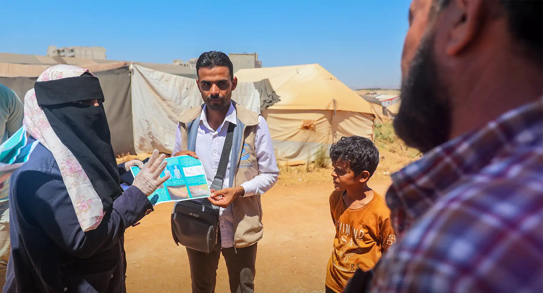 Distribute awareness brochures to families in the camps of rural Idlib ...